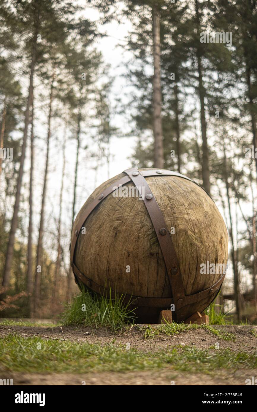 sculpture of a ball in a forest Stock Photo - Alamy