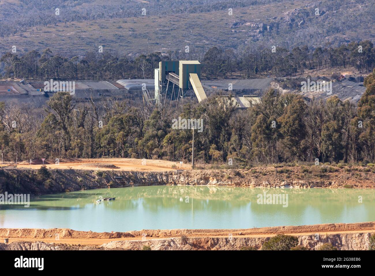 Photograph of transport conveyors in a large colliery surrounded by ...