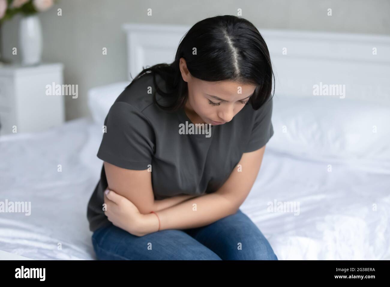Frustrated unhappy girl feeling belly ache, strong stomach pain Stock ...