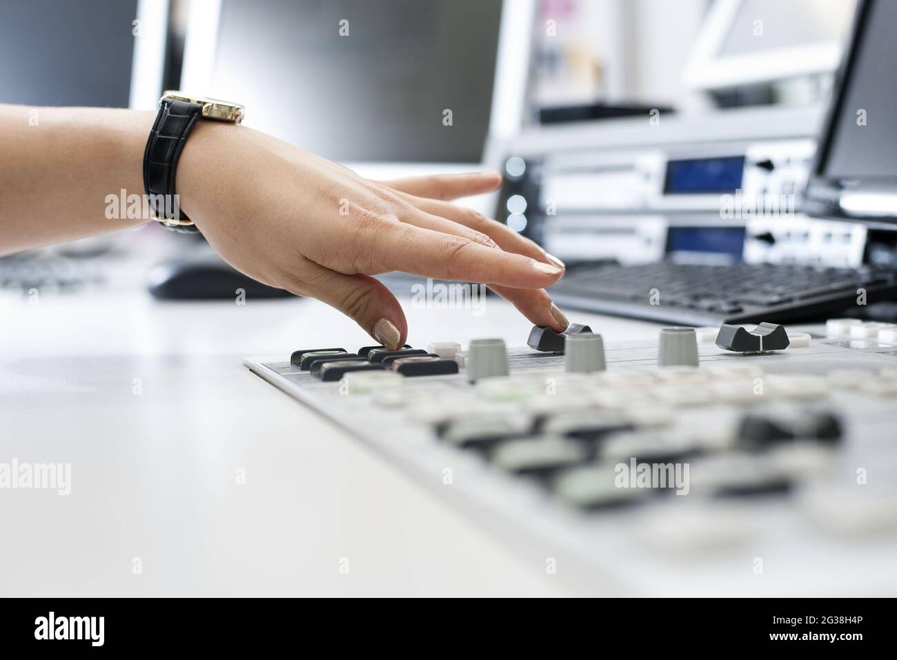 Hand controlling the audio transmission in radiostation Stock Photo - Alamy