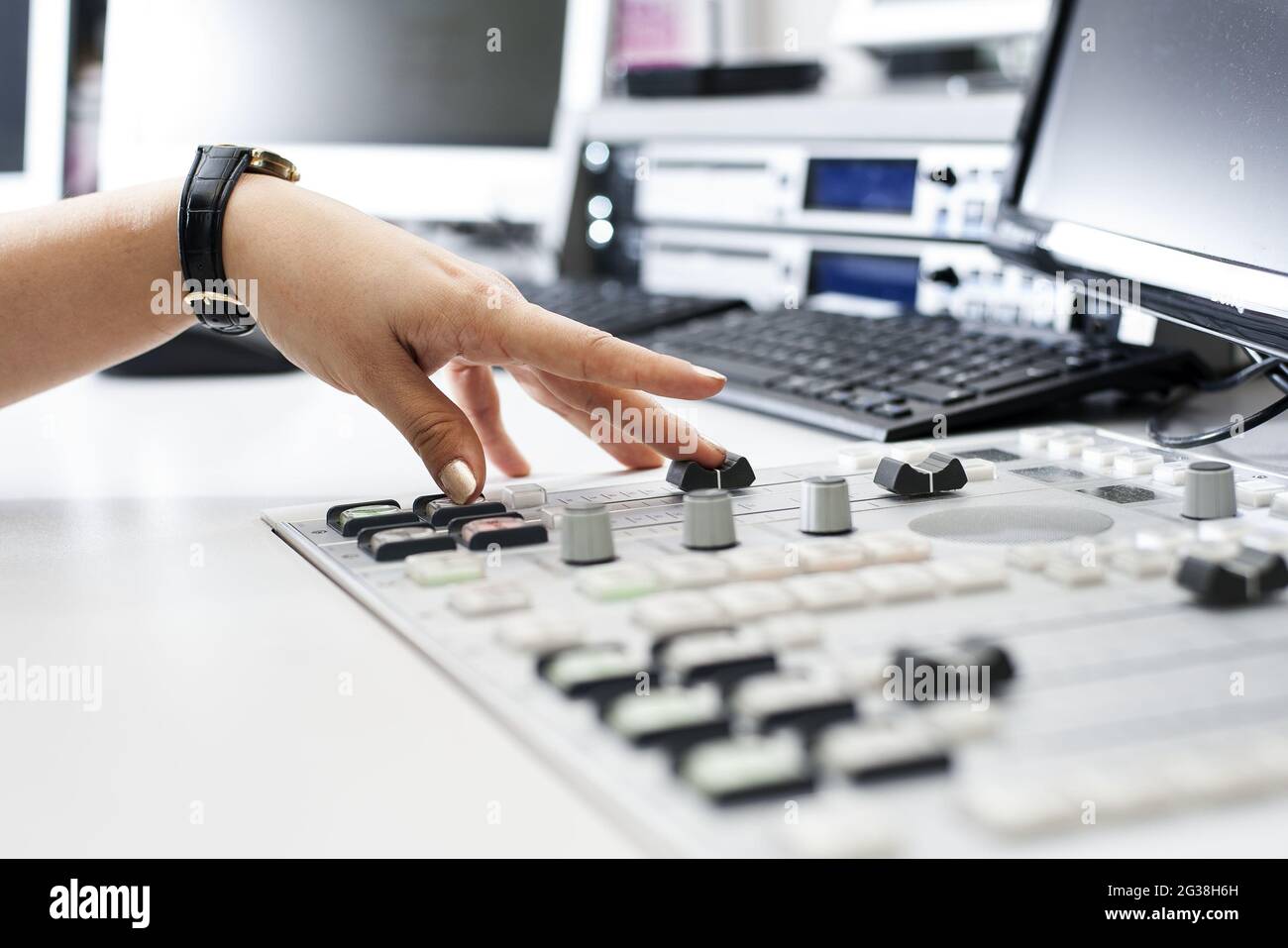Hand controlling the audio transmission in radiostation Stock Photo - Alamy