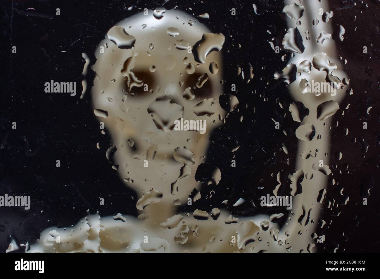 Skeleton captured through the glass covered with water drops Stock ...