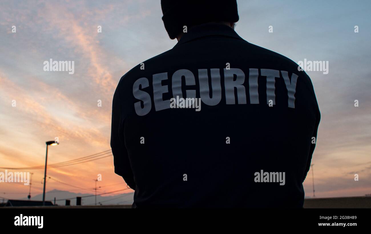 Security guard looking down street hi-res stock photography and images ...