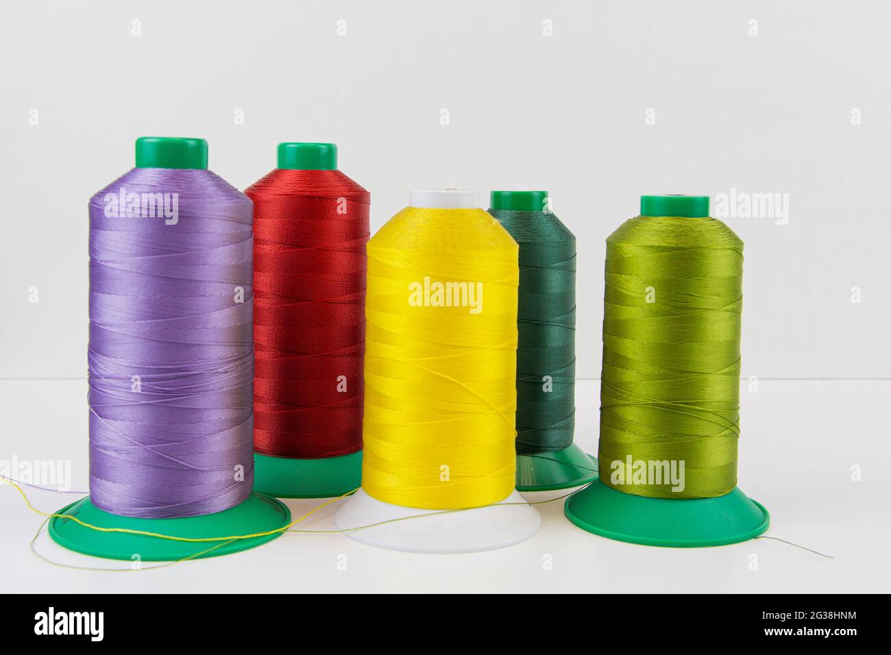 Colorful sewing thread, background, tailor-related images. On a white ...