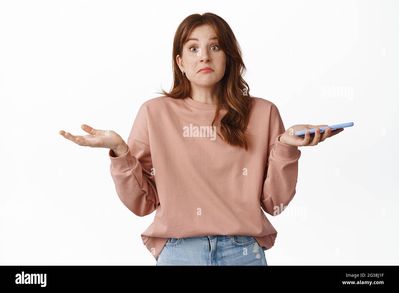 Woman shrugging shoulders hi-res stock photography and images - Alamy