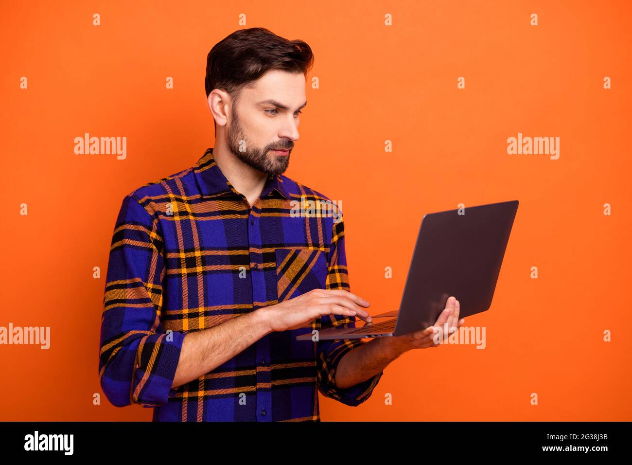 Portrait of young person look use laptop no emotions face wear ...