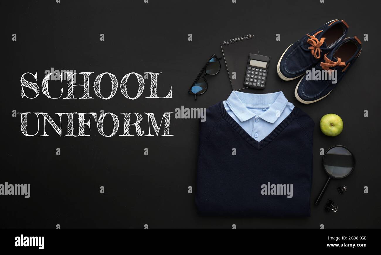 Stylish School Uniform With Accessories On Dark Background Stock Photo
