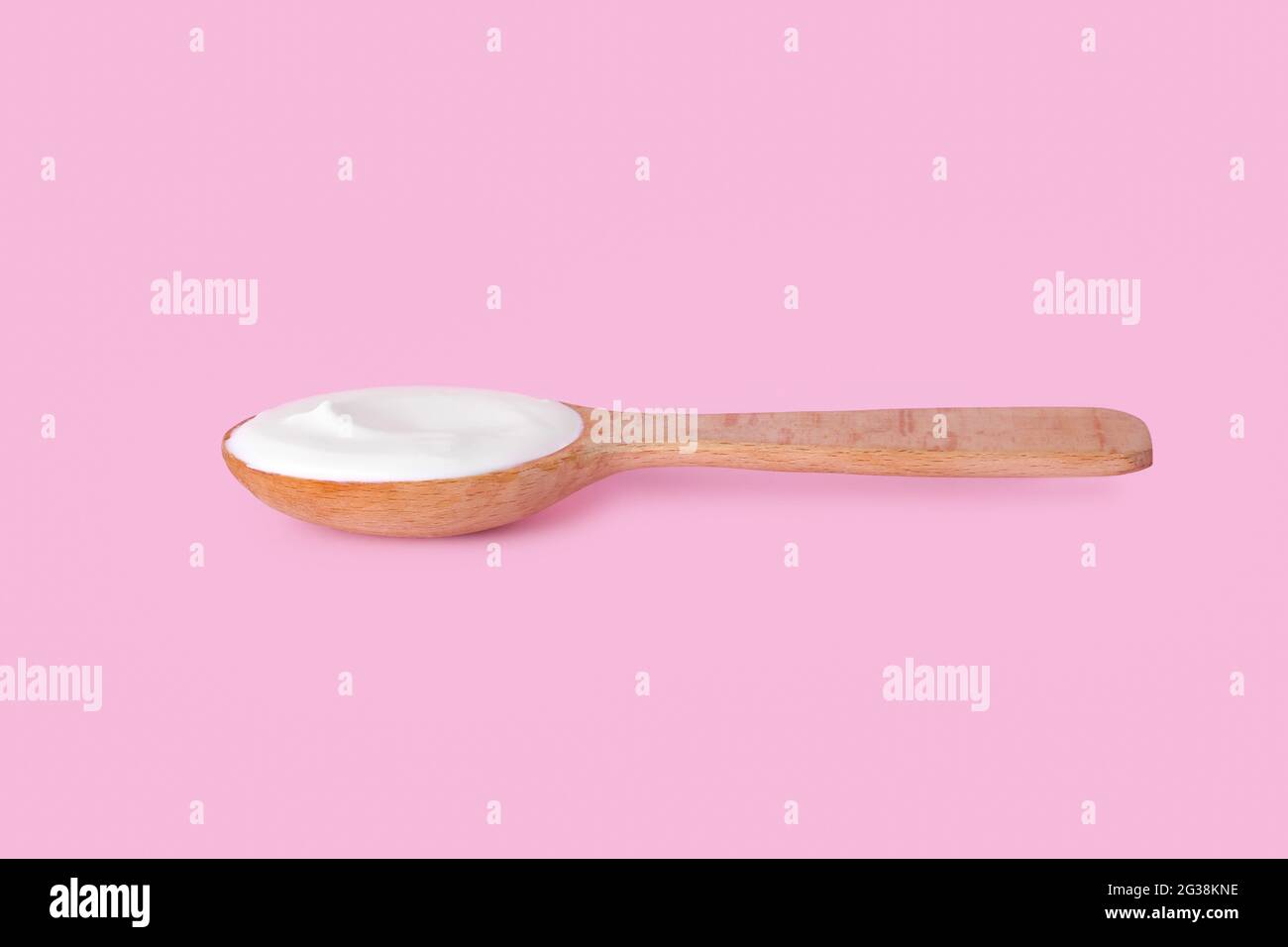 Spoon with tasty yogurt on color background Stock Photo - Alamy
