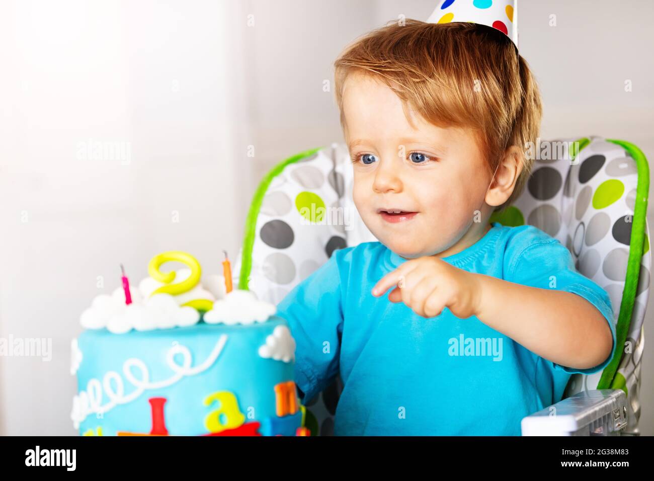 Boy toddler point with finger at birthday cake Stock Photo - Alamy