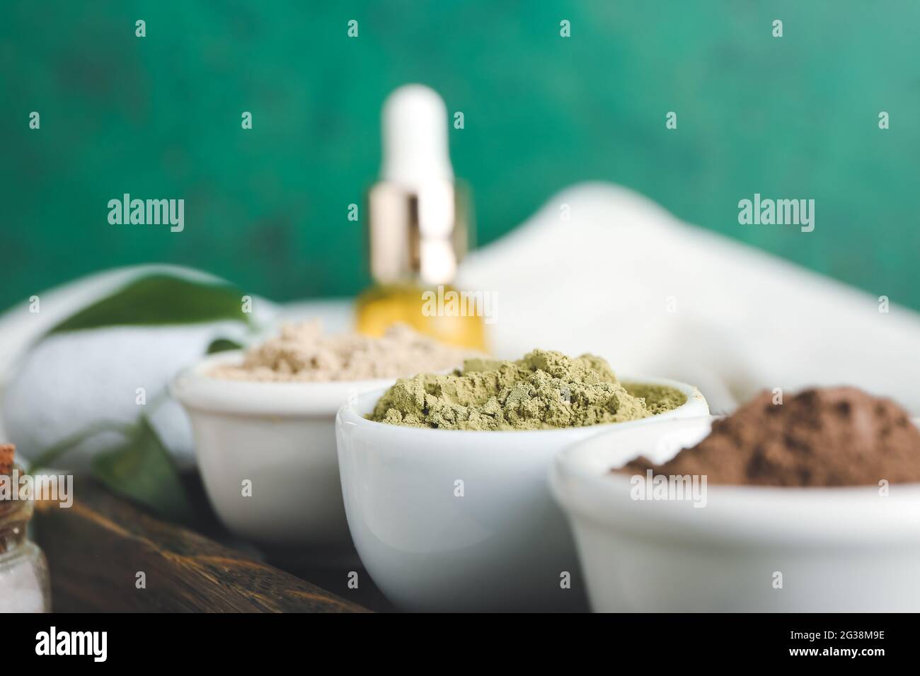 Dry henna powder in bowls on color background, closeup Stock Photo - Alamy