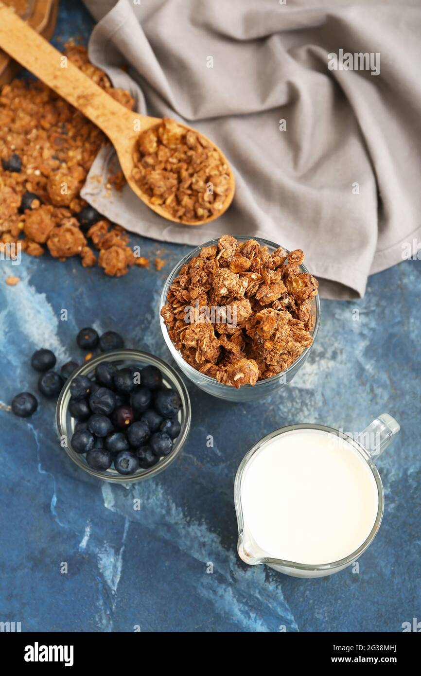 Composition with tasty granola on color background Stock Photo - Alamy