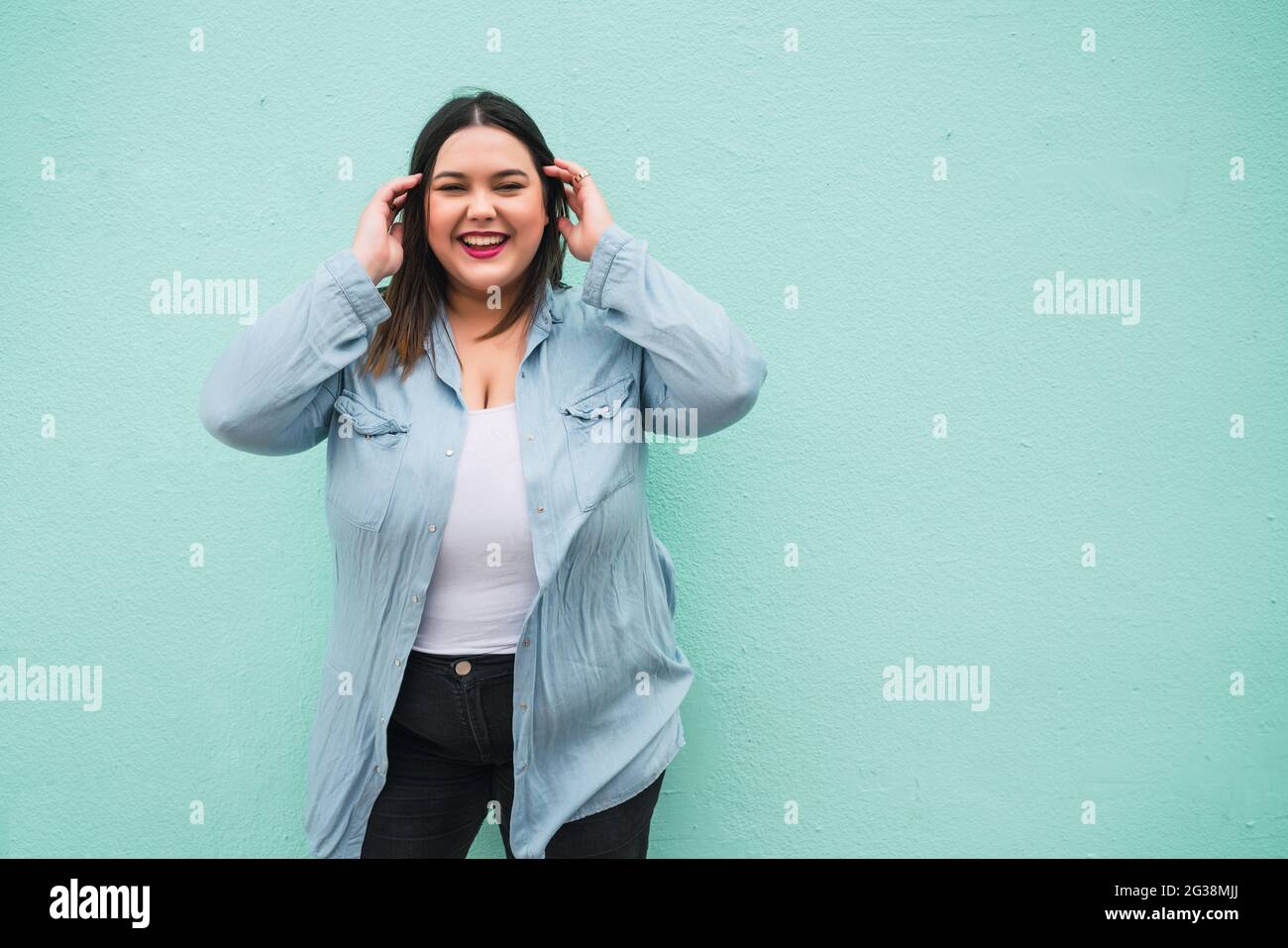 Portrait of young plus size woman Stock Photo - Alamy