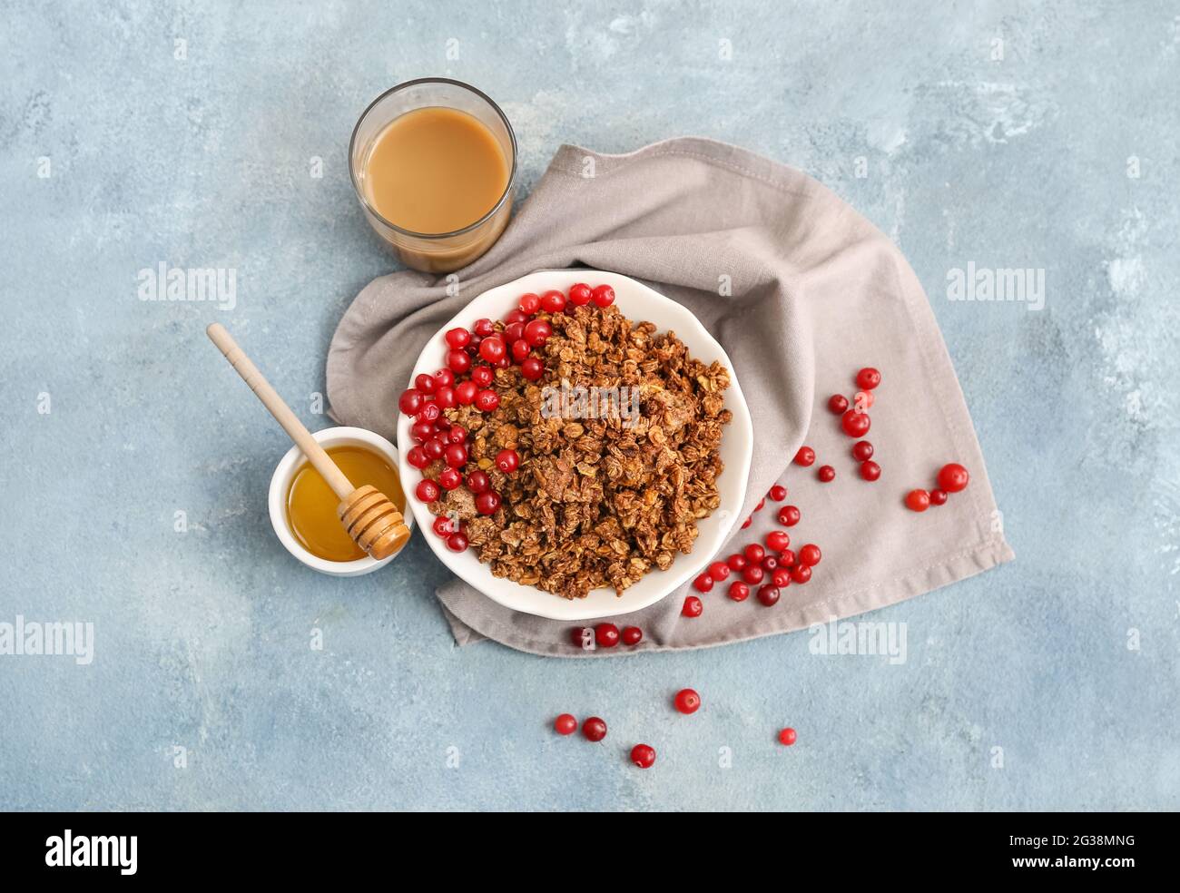 Plate with tasty granola on color background Stock Photo - Alamy