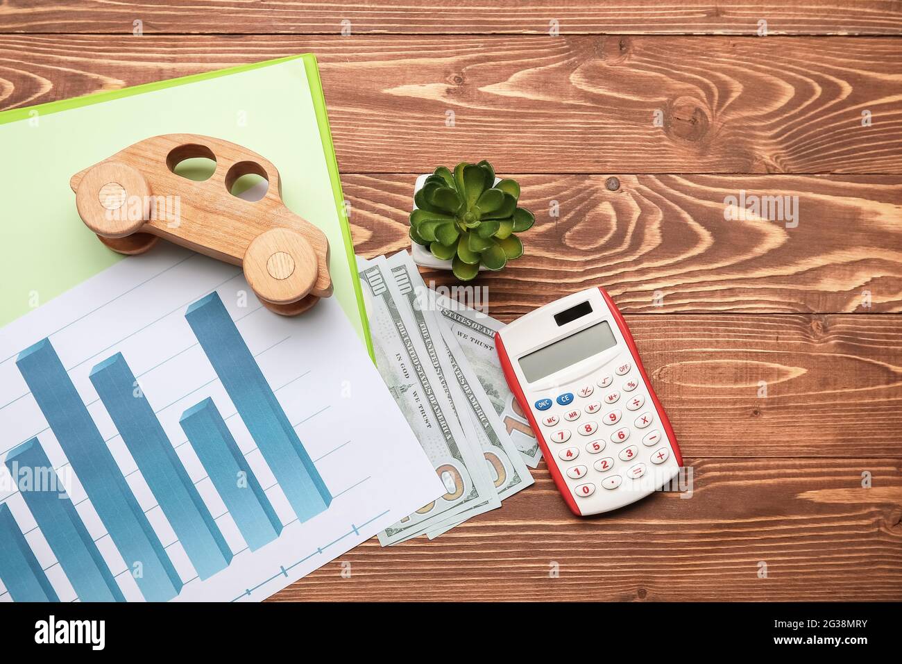 Composition with calculator and chart on wooden background Stock Photo ...