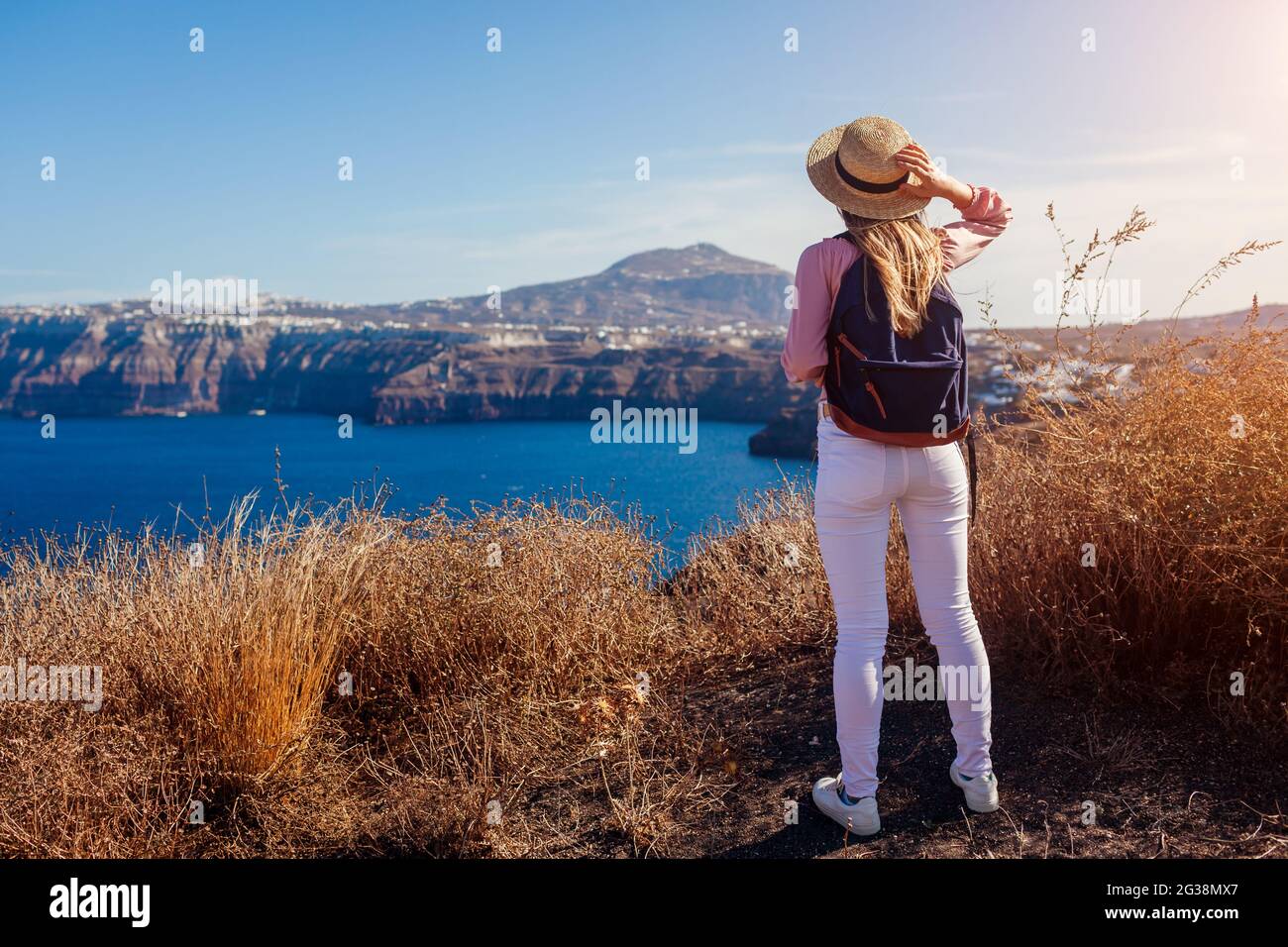 Traveler woman walking on Santorini island, Greece enjoying landscape ...
