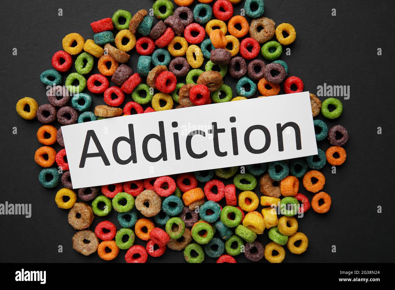 Word ADDICTION and food on dark background Stock Photo - Alamy