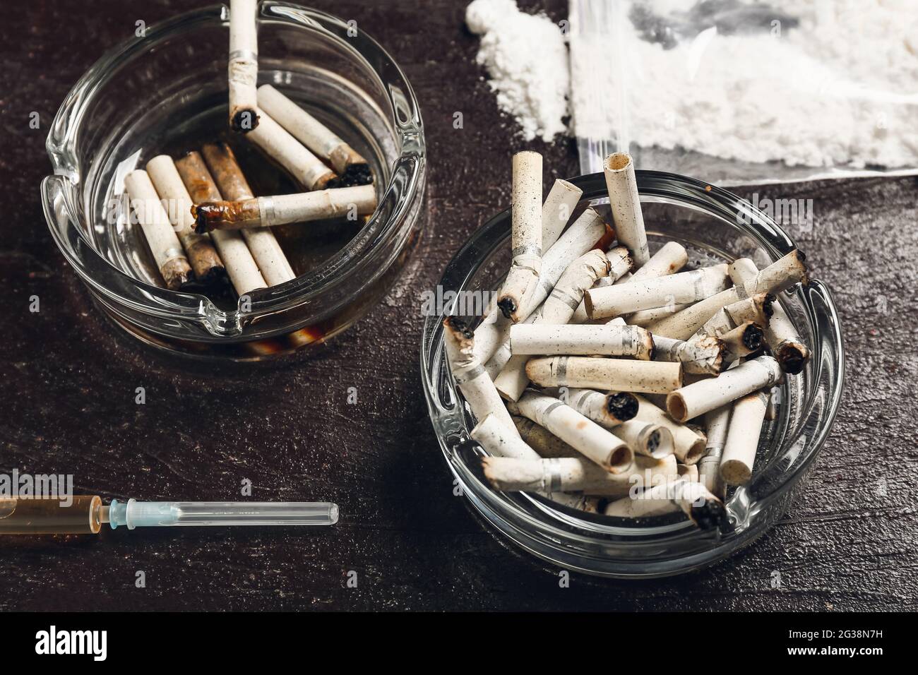 Drugs and cigarettes on dark background. Concept of addiction Stock ...