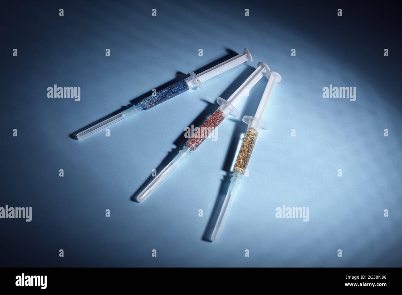 Syringes on color background. Concept of addiction to drugs Stock Photo ...