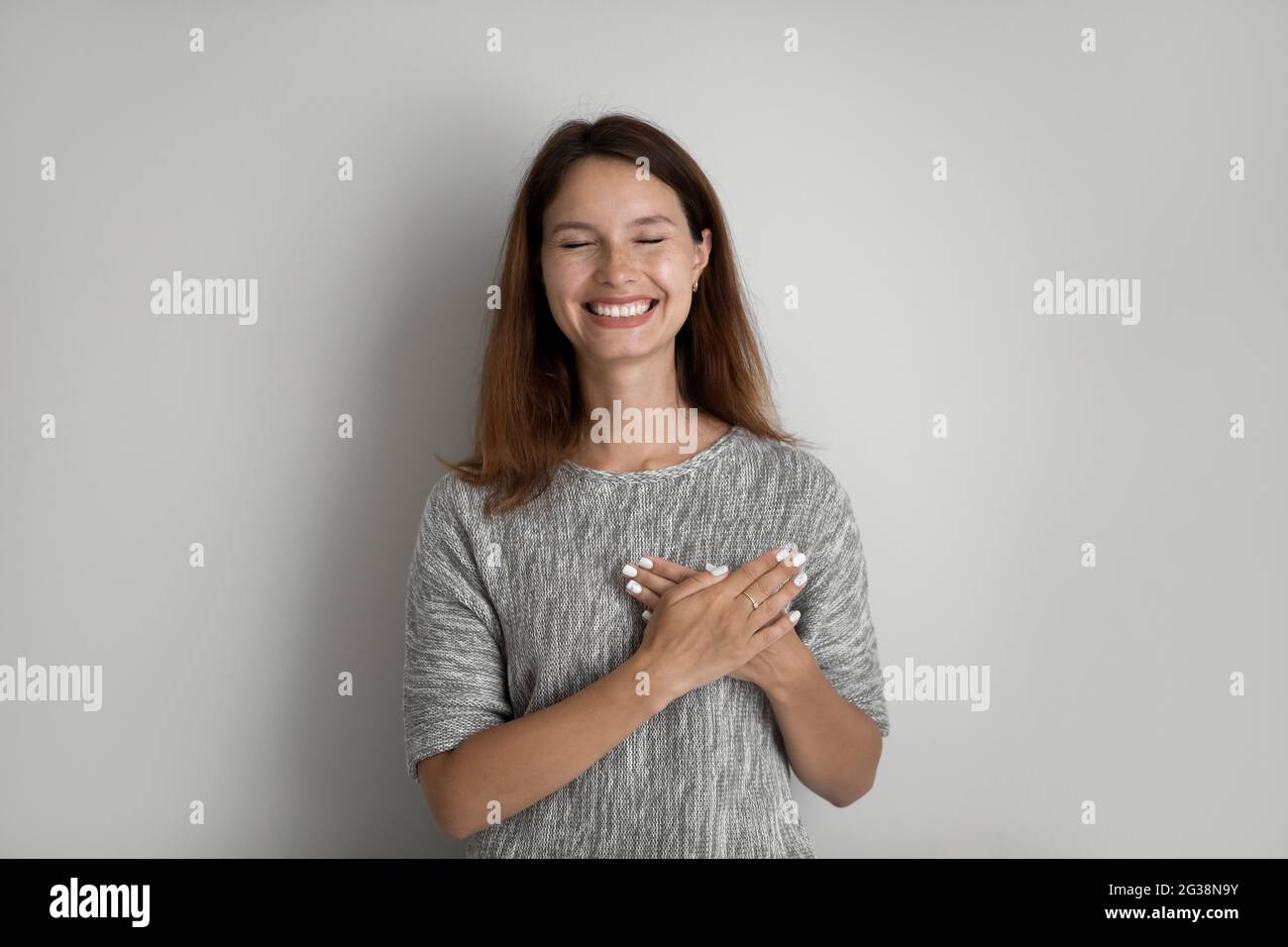 Hands folded to chest hi-res stock photography and images - Alamy