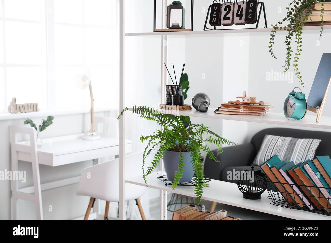 Modern book shelf with decor in interior of room Stock Photo - Alamy