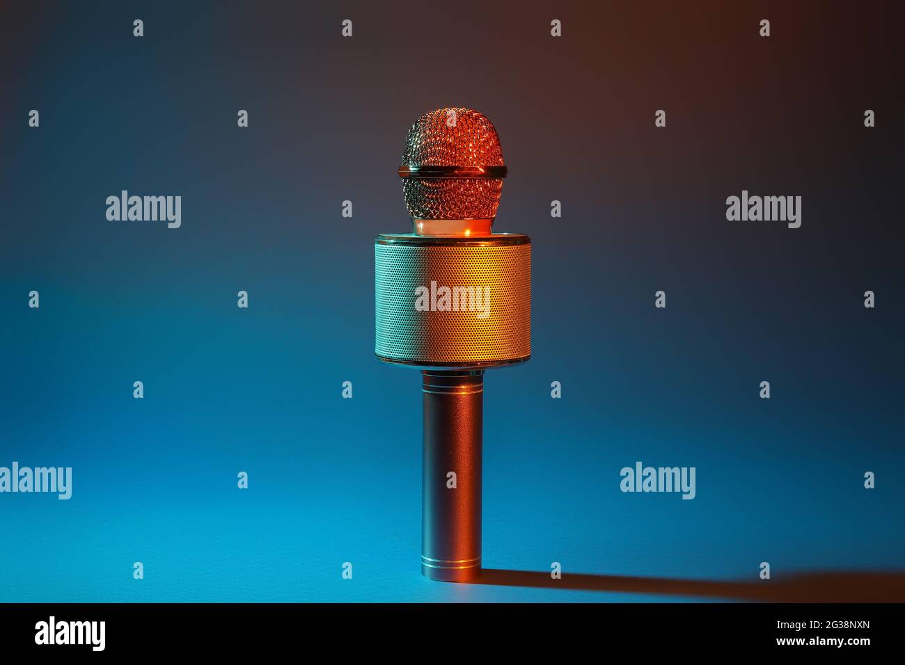Modern microphone on dark color background Stock Photo - Alamy