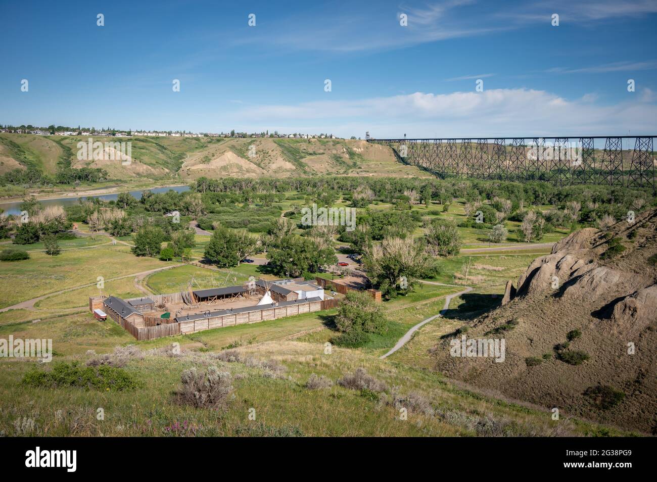 Lethbridge's Fort Whoop-up in summer with rail viaduct in the ...