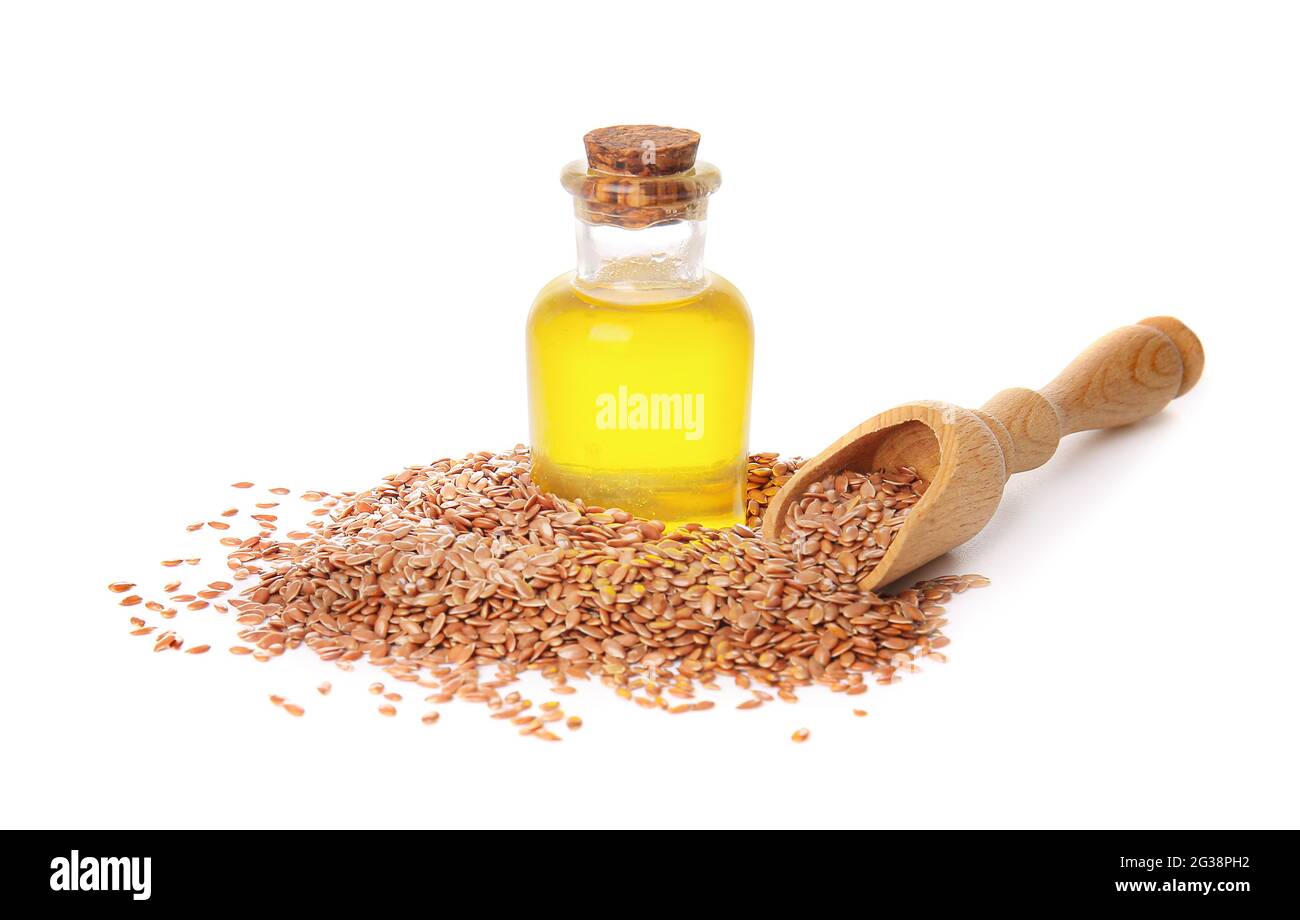 Bottle of flax oil and seeds on white background Stock Photo - Alamy