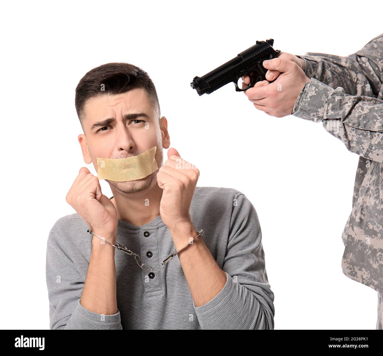 Terrorist aiming at hostage on white background Stock Photo - Alamy