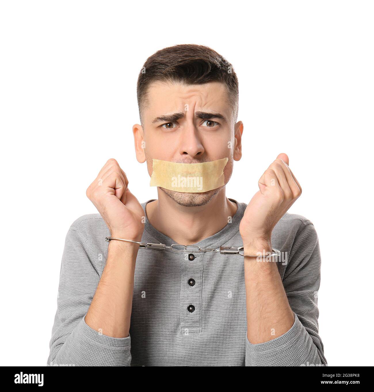 Male hostage on white background Stock Photo - Alamy