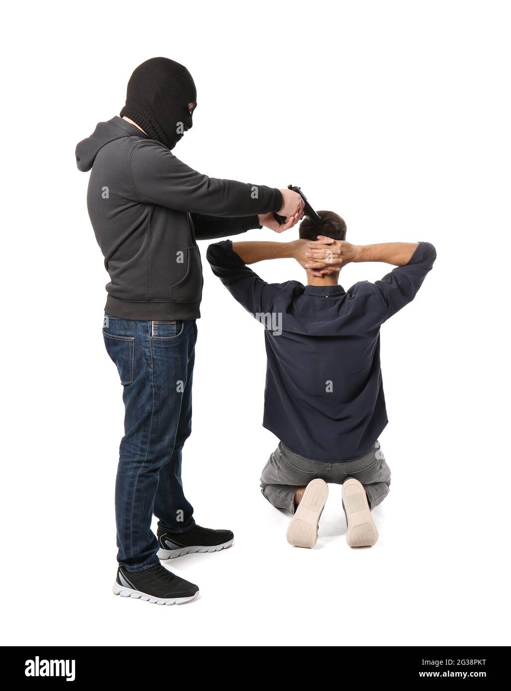 Terrorist aiming at hostage on white background Stock Photo - Alamy