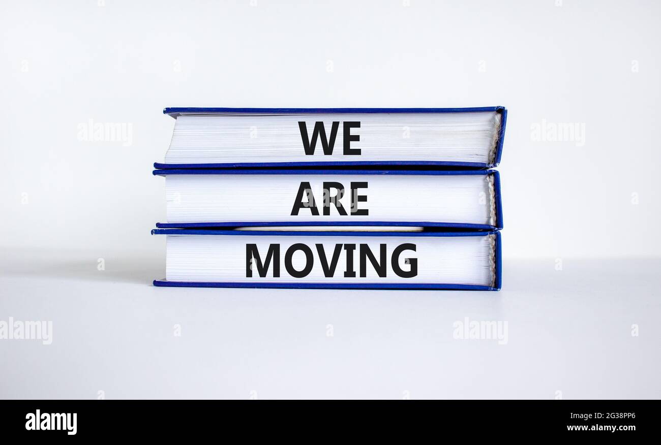 We are moving symbol. Books with words 'We are moving'. Beautiful white ...