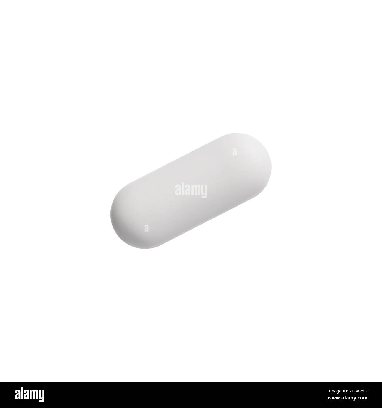 One pill on white background Stock Photo - Alamy
