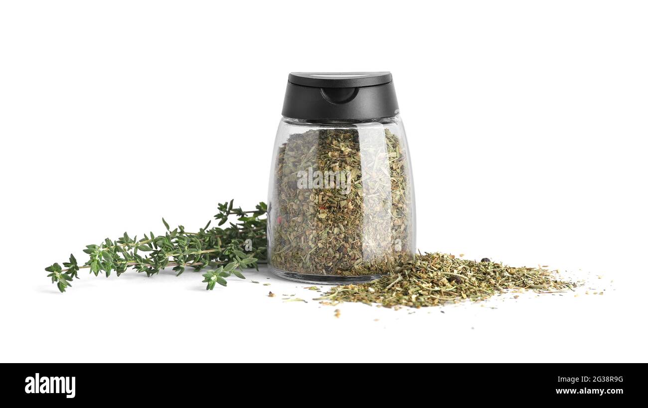 Jar with dried herbs and fresh thyme on white background Stock Photo ...