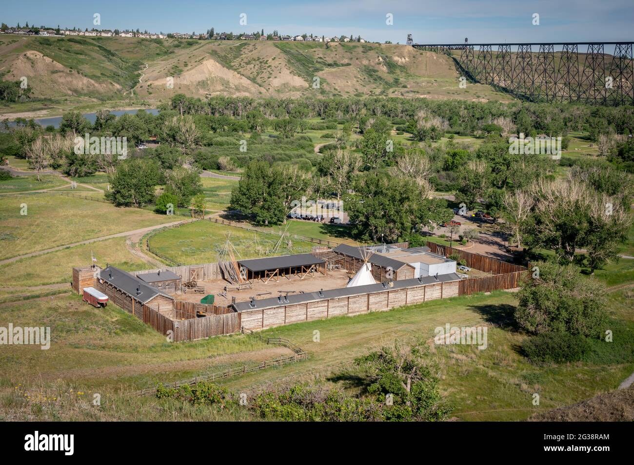 Lethbridge's Fort Whoop-up in summer with rail viaduct in the ...