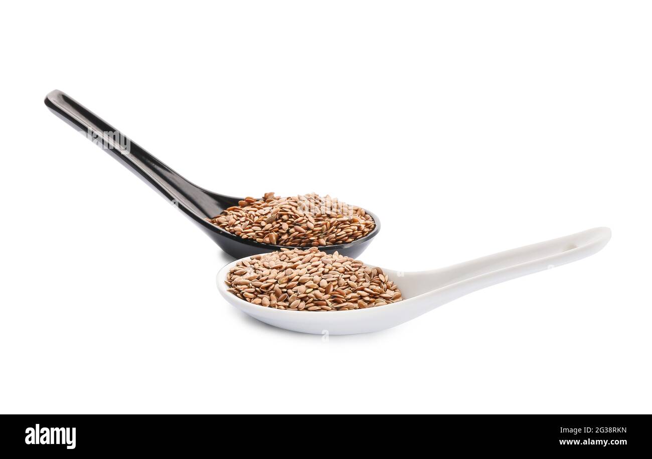 Spoons with flax seeds on white background Stock Photo - Alamy
