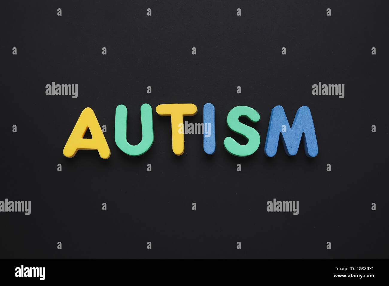 Word AUTISM on dark background Stock Photo - Alamy
