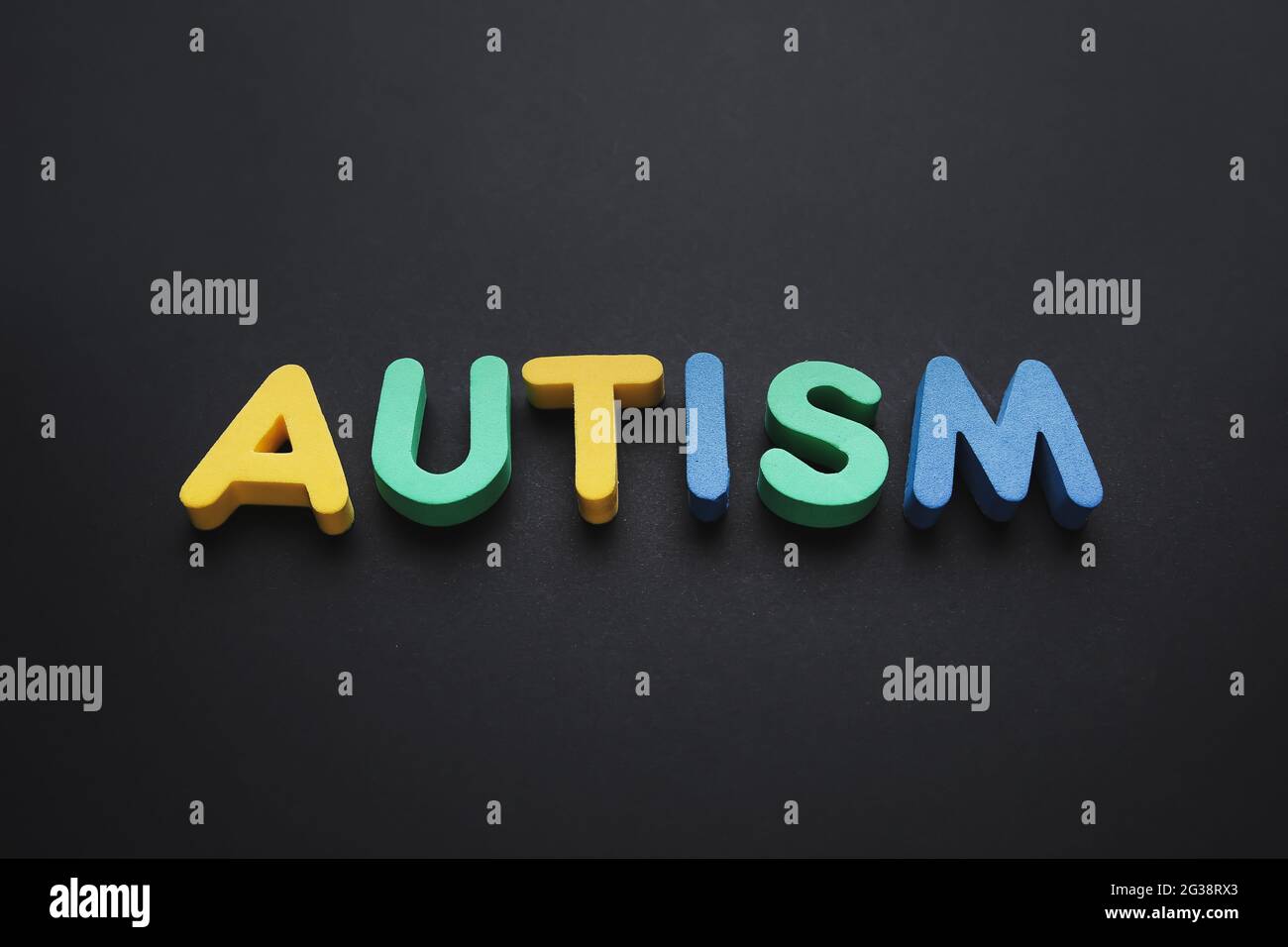 Word AUTISM on dark background Stock Photo - Alamy