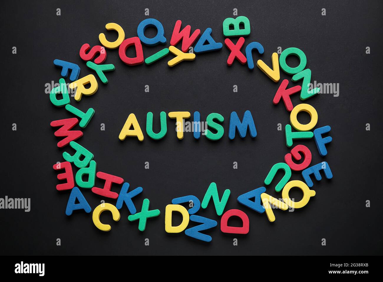 Word AUTISM on dark background Stock Photo - Alamy