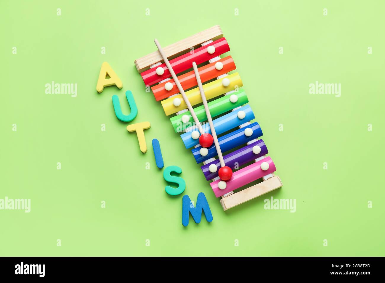 Word AUTISM and xylophone on color background Stock Photo - Alamy
