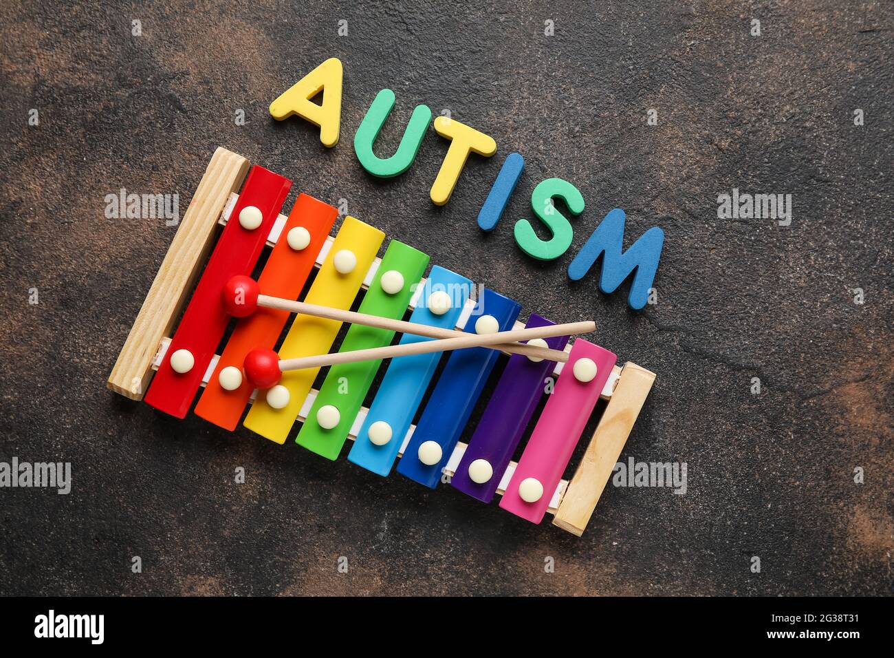 Word AUTISM and xylophone on grunge background Stock Photo - Alamy