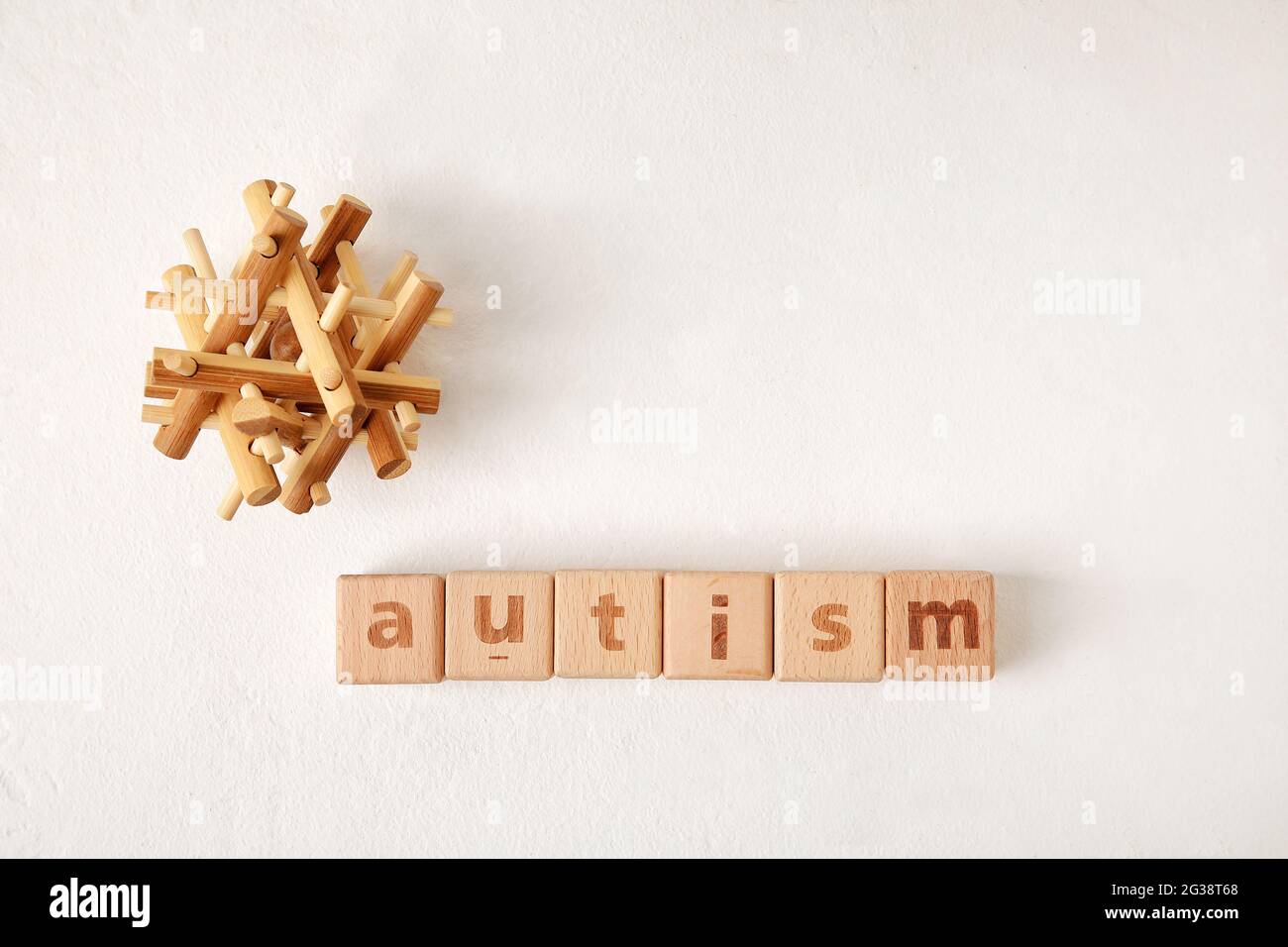 Word AUTISM made of cubes and toy on white background Stock Photo - Alamy
