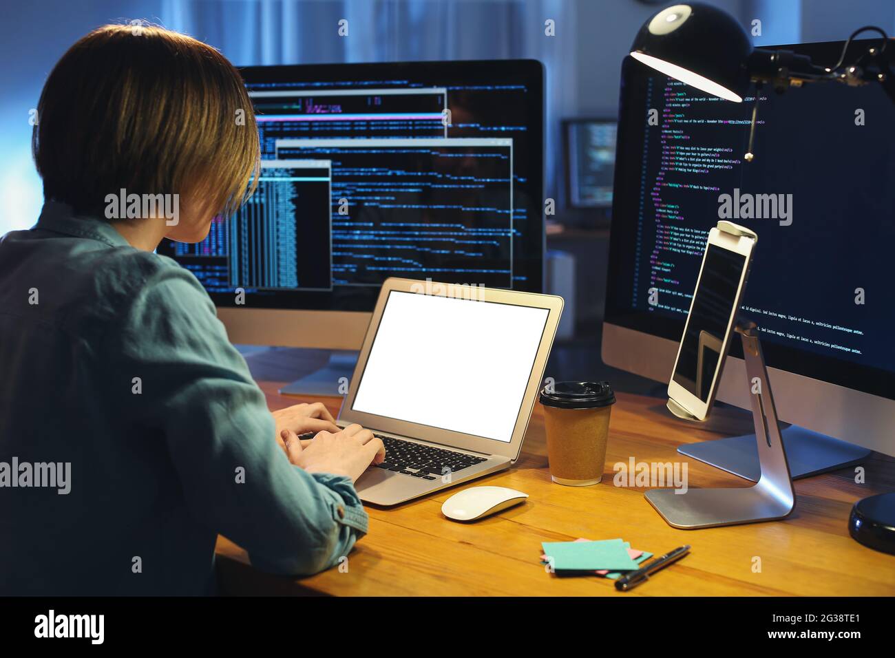 Female programmer working in office at night Stock Photo - Alamy