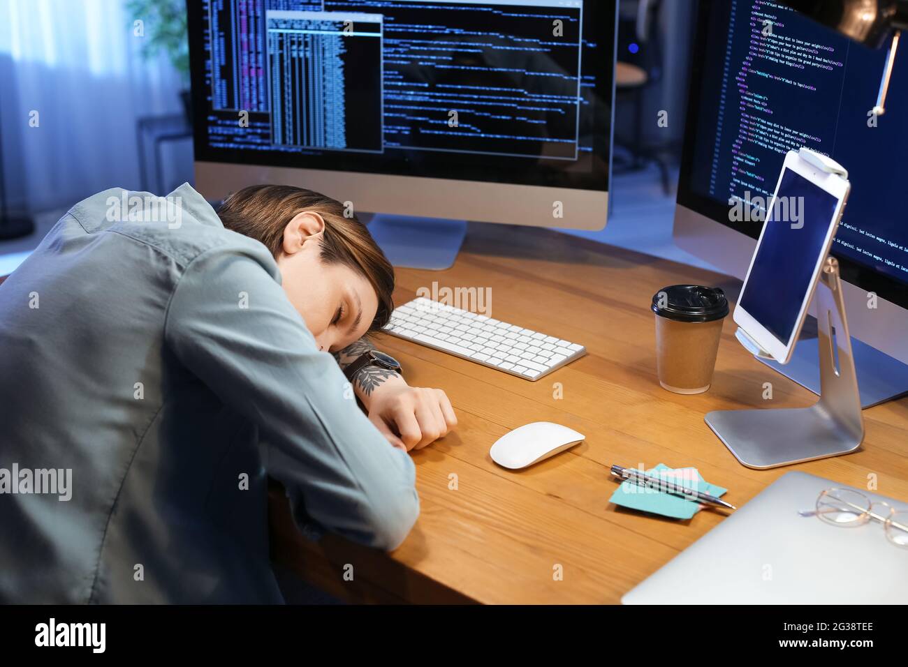 Female programmer sleeping in office at night Stock Photo - Alamy