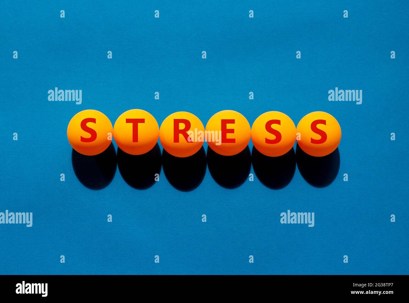 Stress and business symbol. The concept word 'stress' on orange table ...