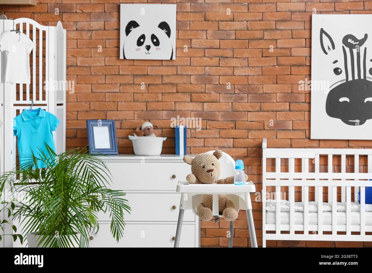 Stylish interior of modern children's room with feeding chair Stock ...