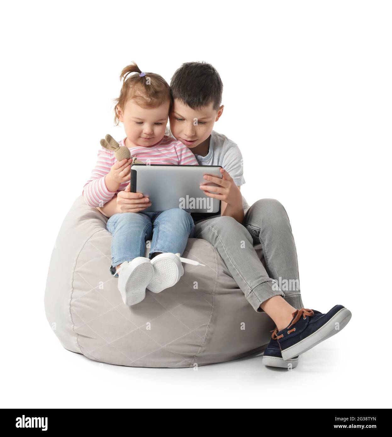 Cute little children using tablet computer on white background Stock ...