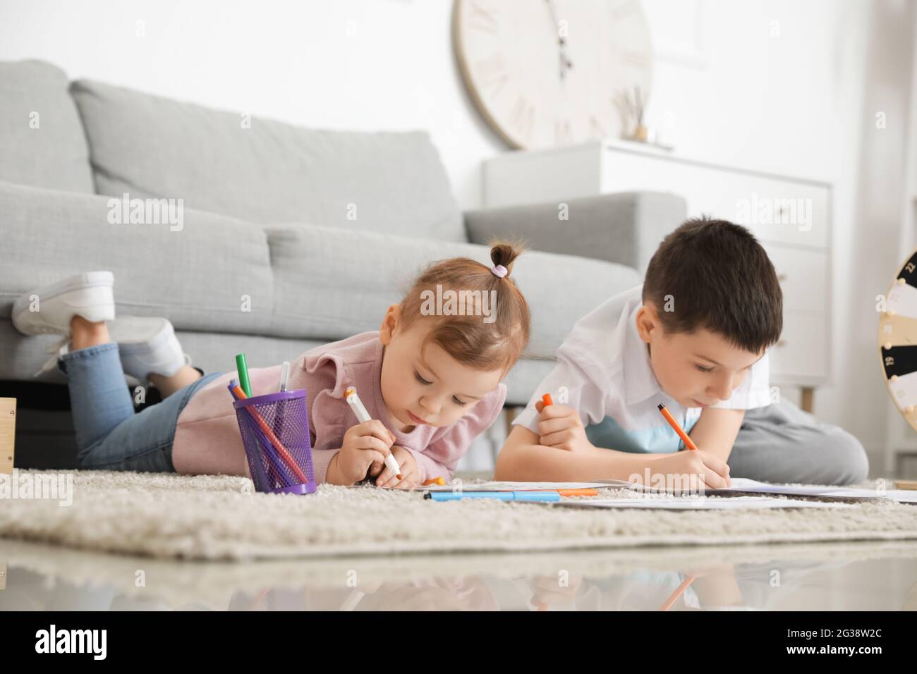 Cute little children drawing at home Stock Photo - Alamy