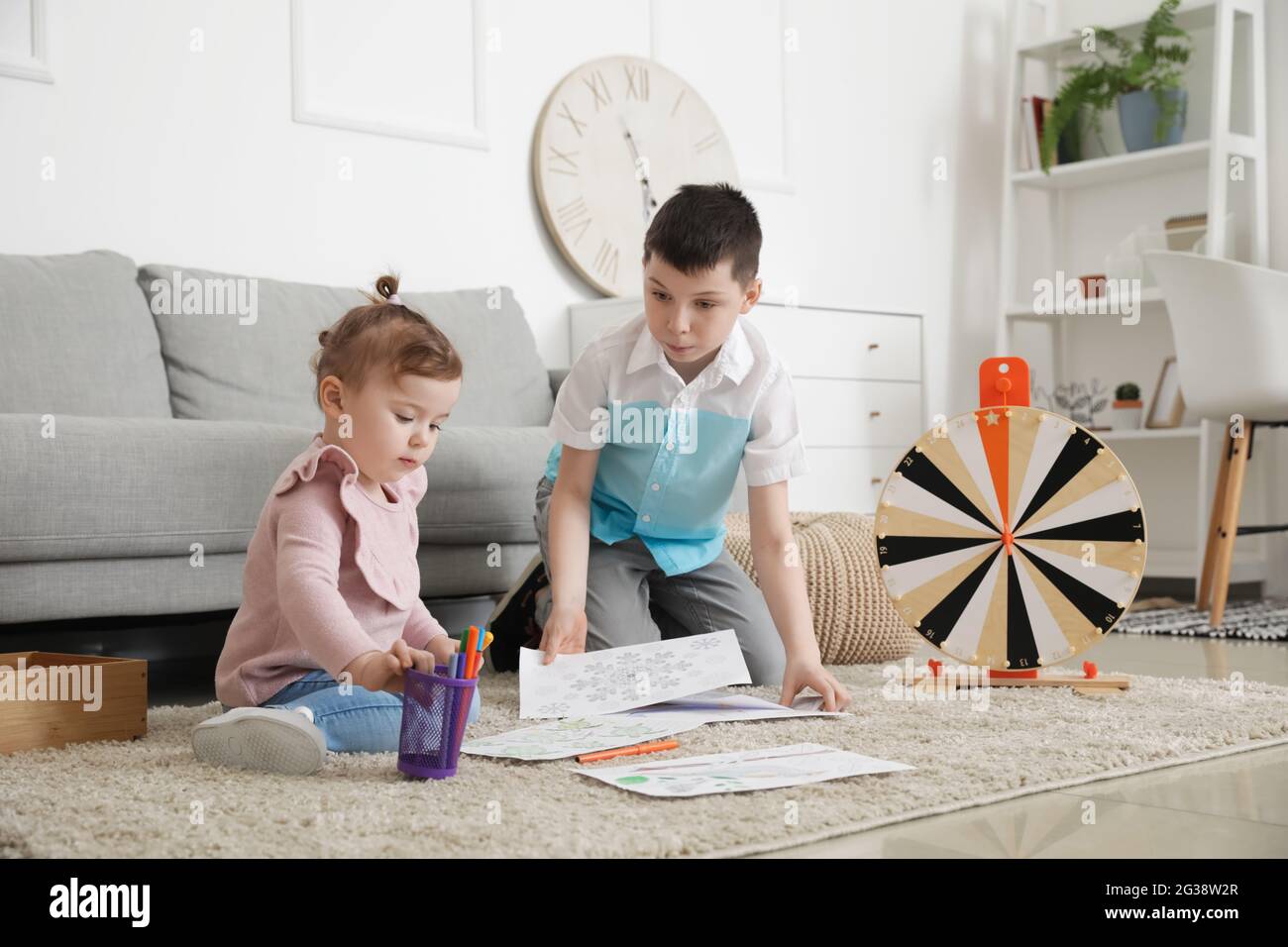 Cute little children drawing at home Stock Photo - Alamy