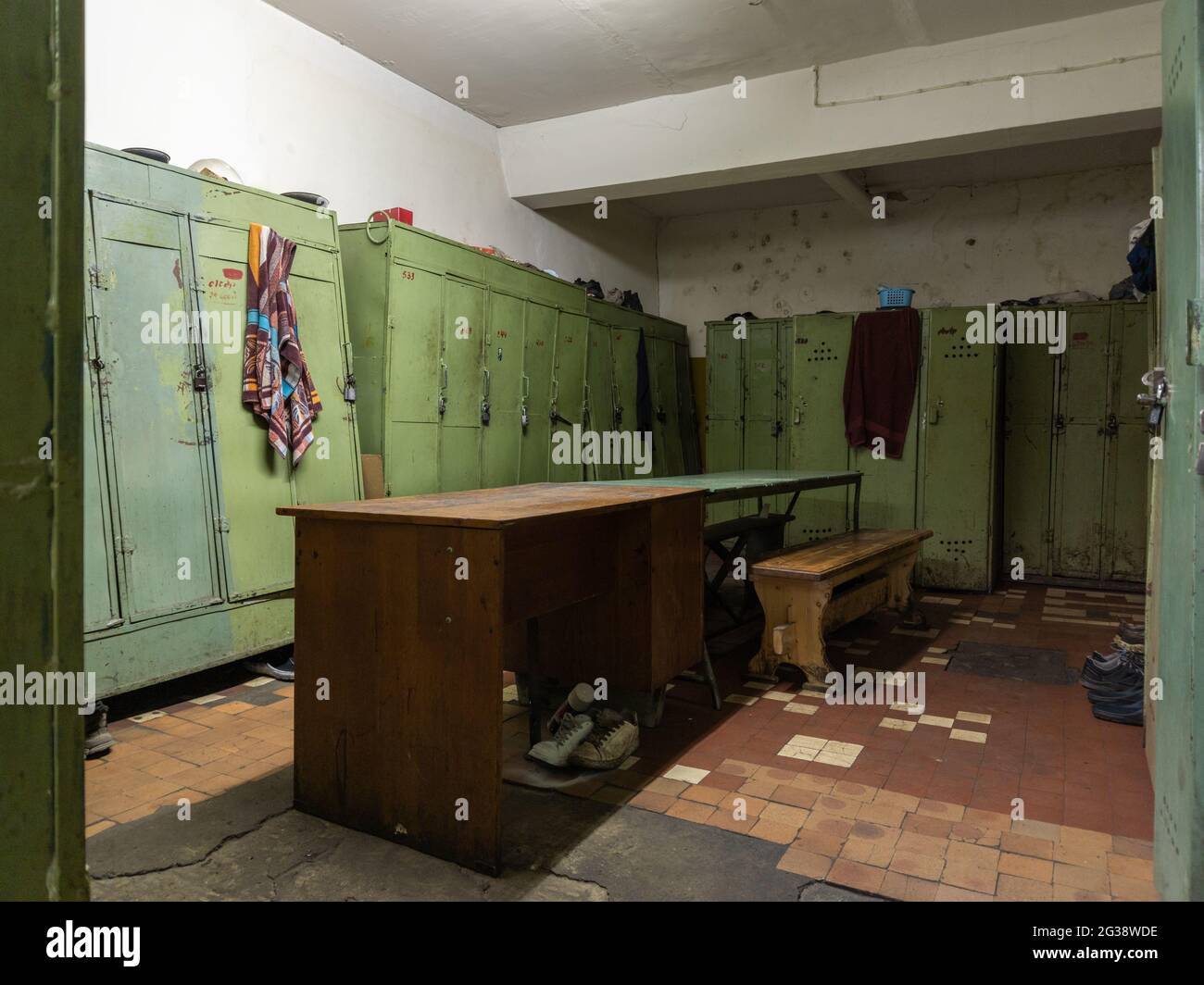 old dirty locker room in soviet factory with table and benches Stock ...