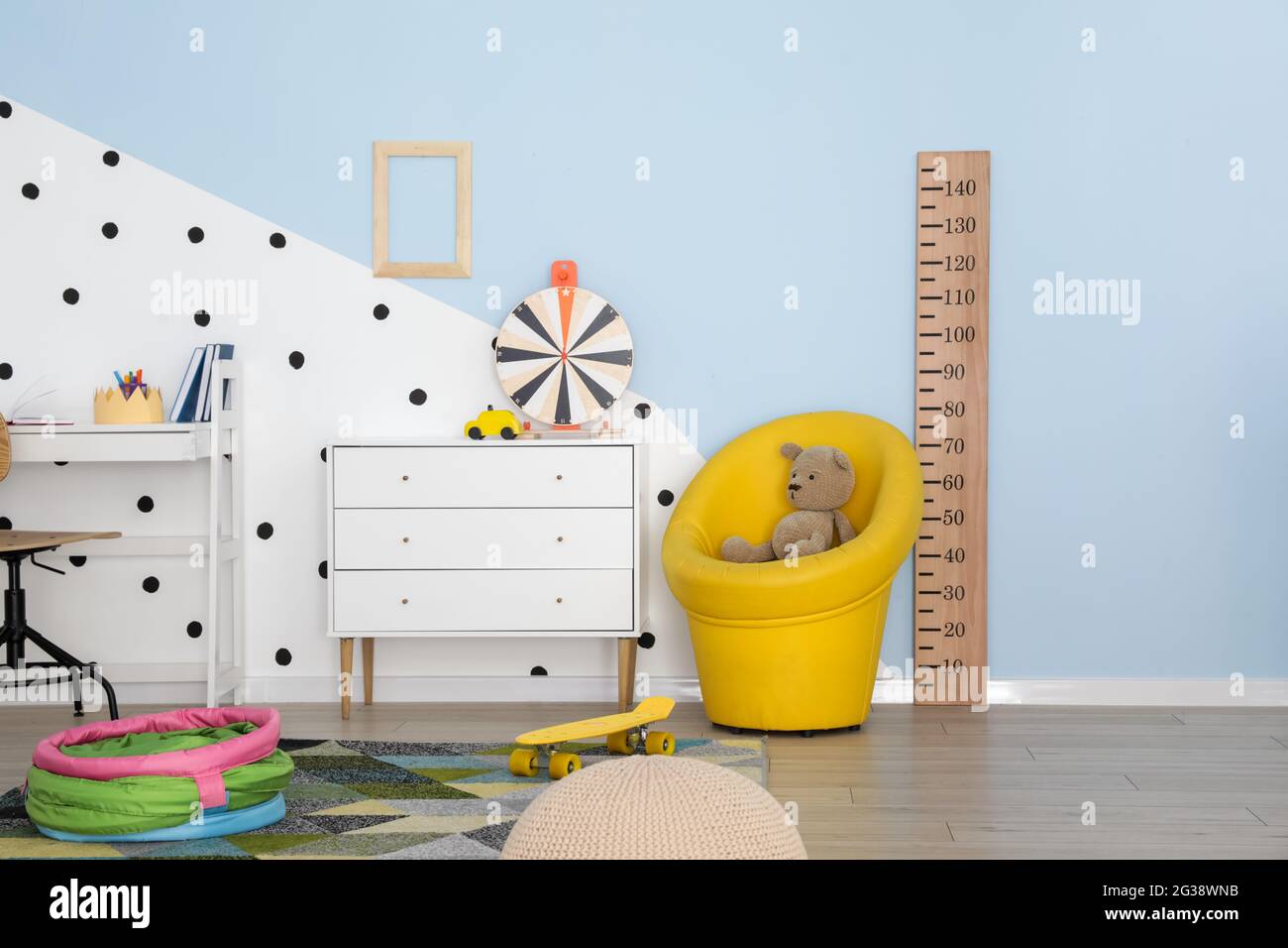 Stylish interior of modern children's room with wooden stadiometer ...